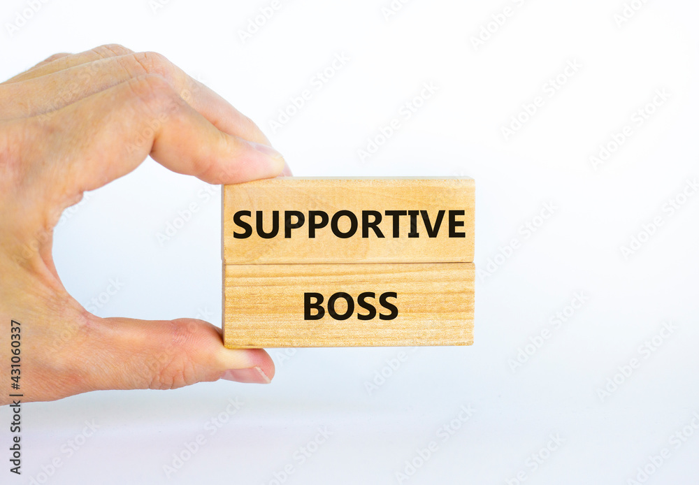 Supportive boss symbol. Wooden blocks with words 'Supportive boss' on ...