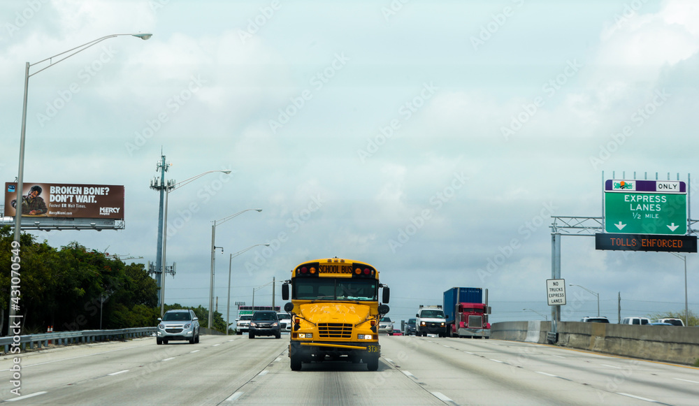Miami, Florida, USA 2.09.2020 - yellow School bus on highway against ...