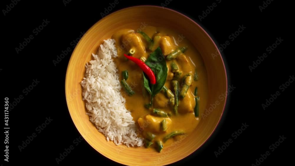 Plate rotates on black table, top view. On a spinning plate fresh asian ...