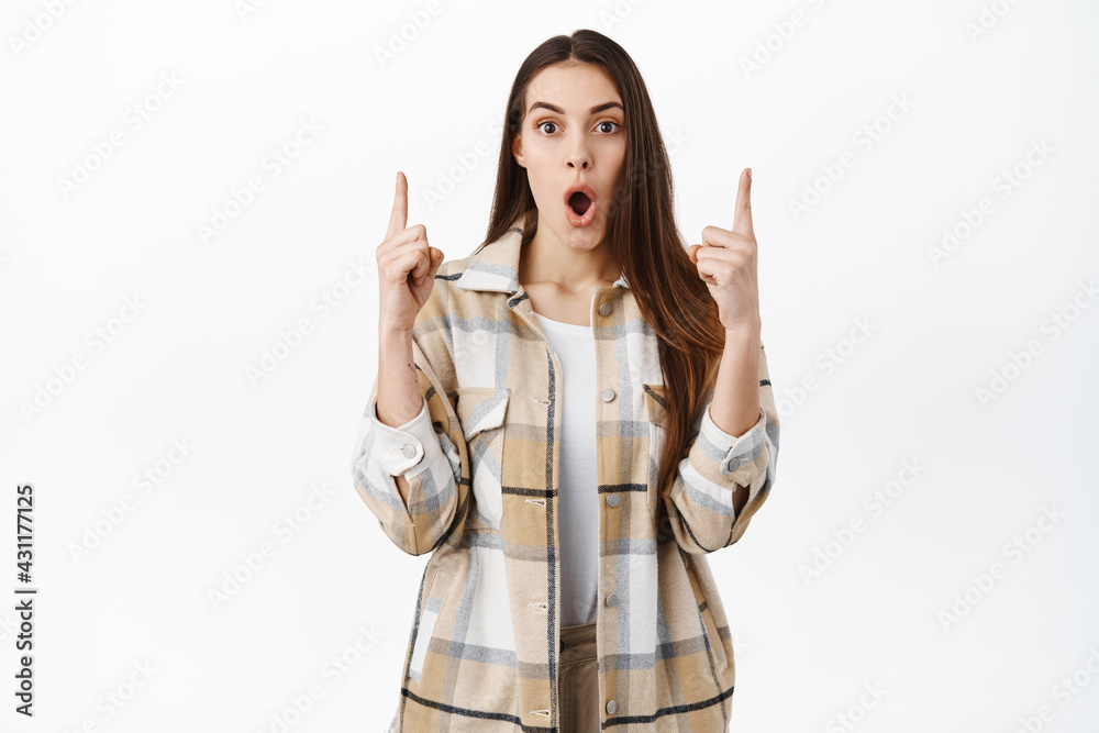 Wow check it out, look up. Excited and surprised woman drop jaw ...