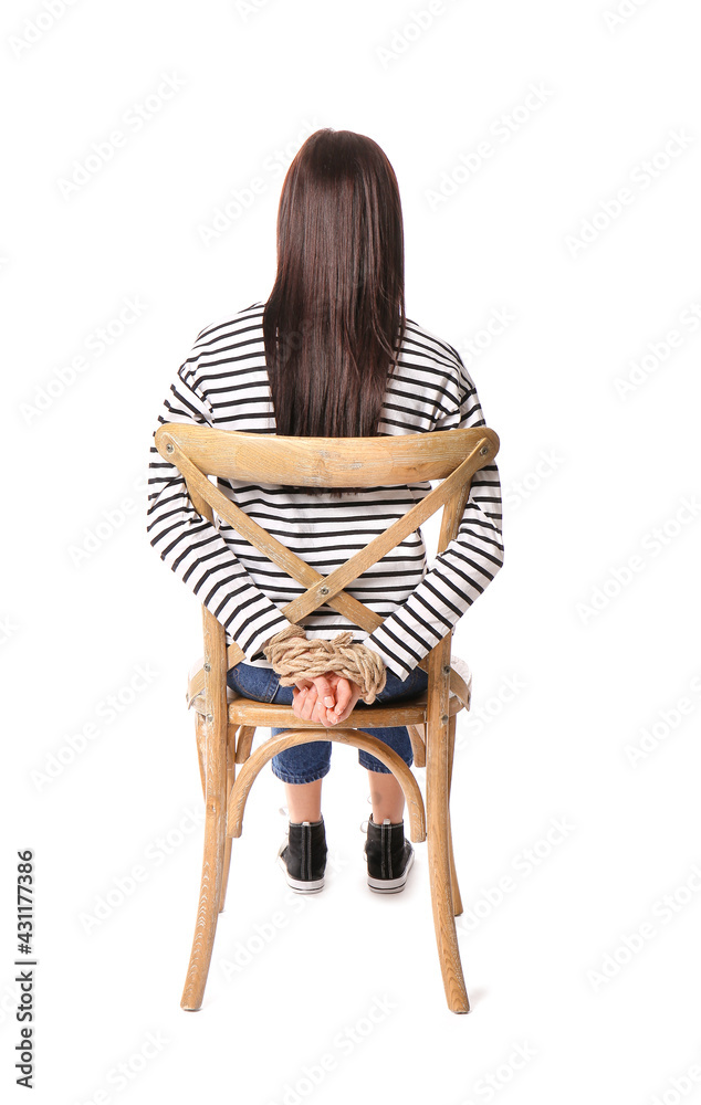 Female hostage sitting on chair against white background Stock Photo ...