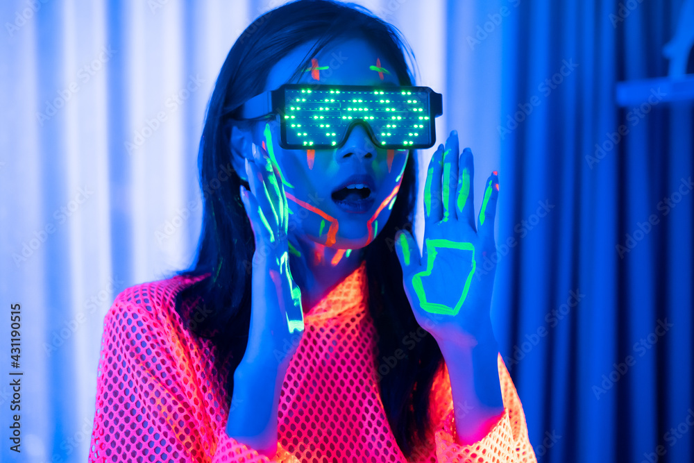 Neon asian woman dancing. Fashion model woman in neon light, portrait ...