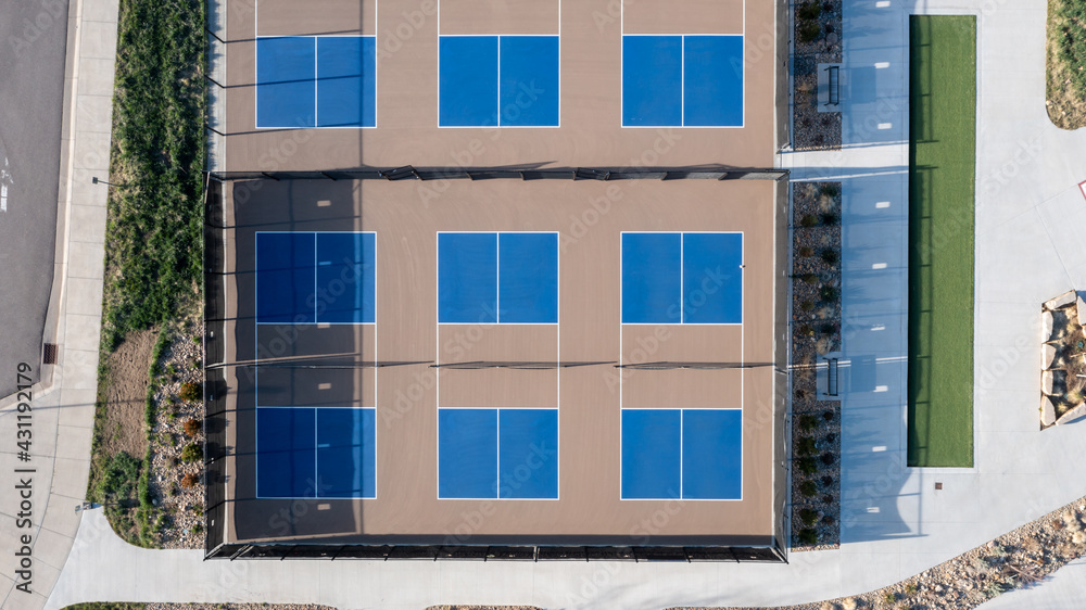 Overhead aerial of multiple pickle ball fields with some landscaping ...