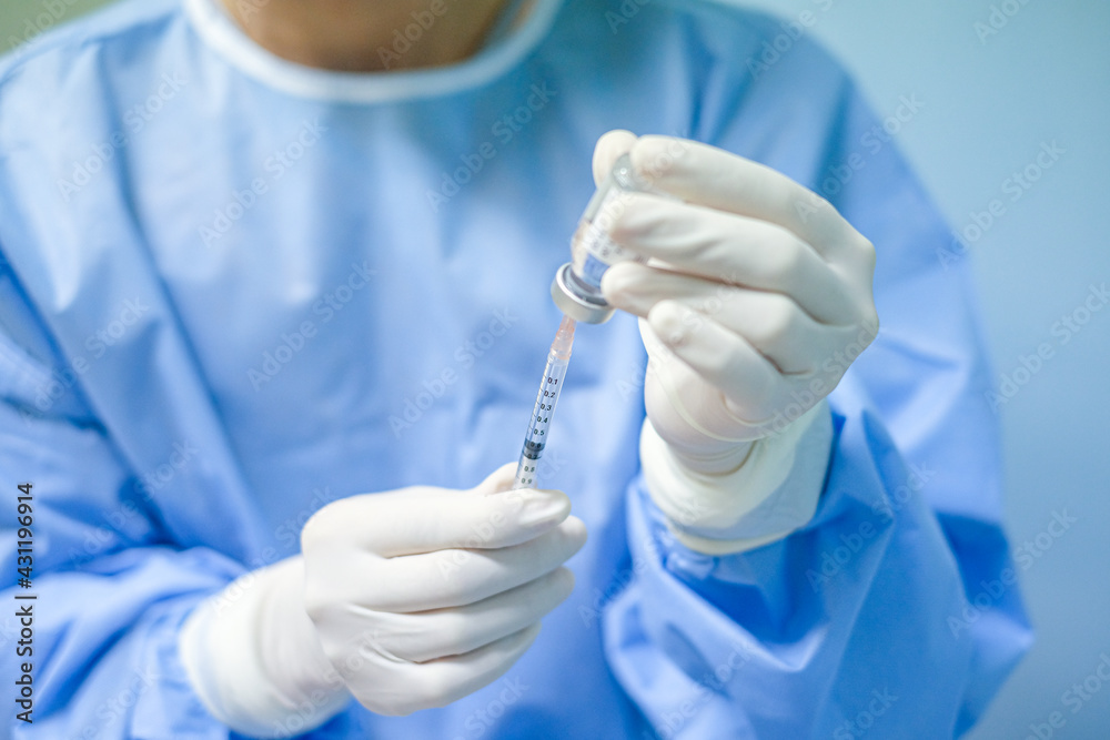 doctor holds syringe and vaccine bottle for infection cure (Focus at ...