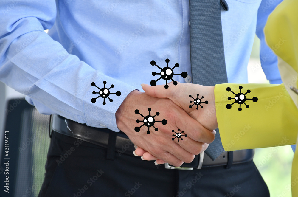 Foto de The handshake of male and female businessmen is one of the ...
