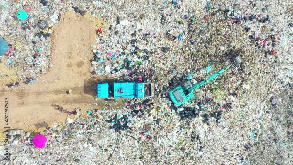 Garbage pile in trash dump or open landfill, Trash trucks dump waste ...