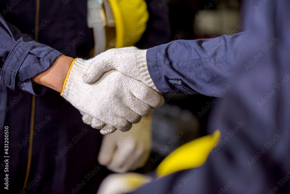 team of engineer mechanic man get handshake together after checking and ...
