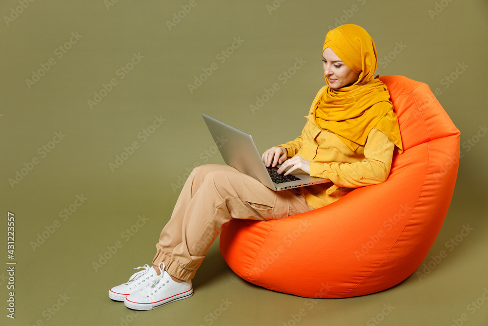 Full length young arabian asian muslim woman 20s in abaya hijab yellow ...