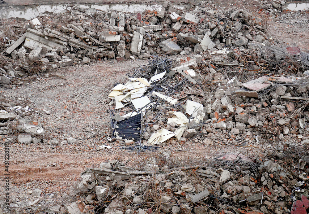 Materials and debris on the ground during the demolition of a ...