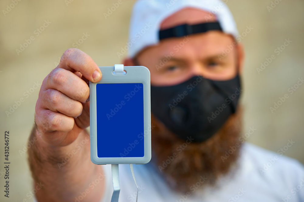 Human holds a covid-19 vaccination card. Medical concept of male with ...