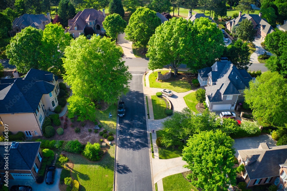 Top down view of beautiful houses in an upscale subdivision in suburbs ...