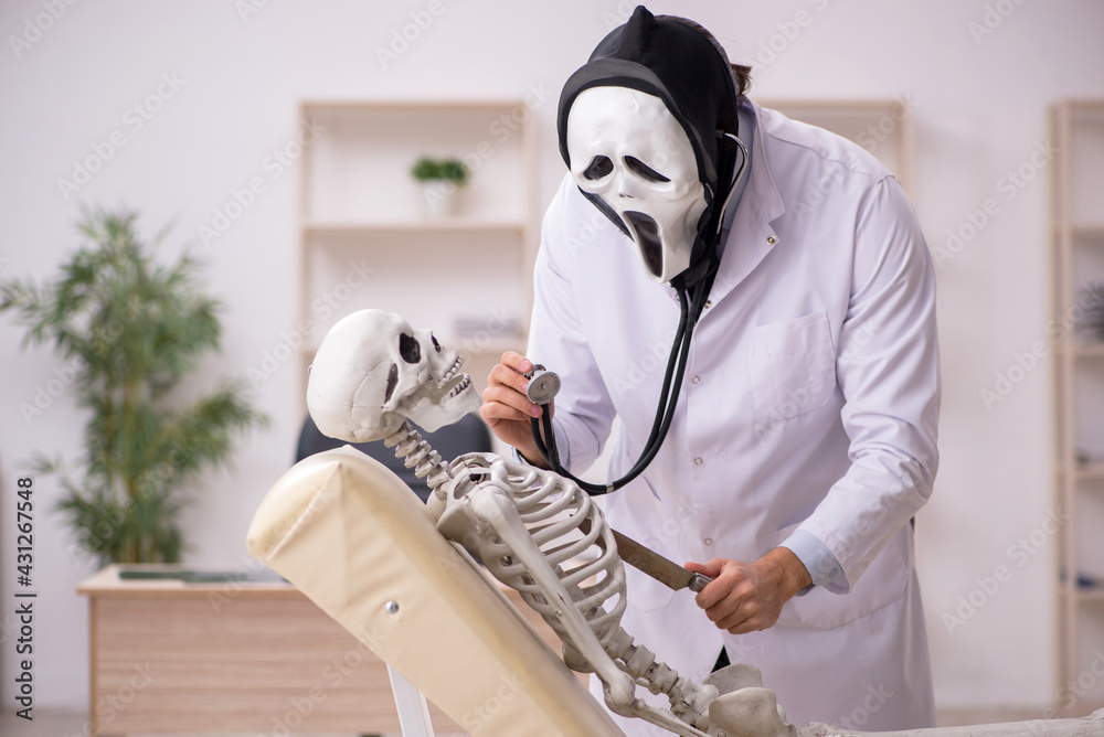 Devil doctor examining skeleton patient Stock Photo | Adobe Stock