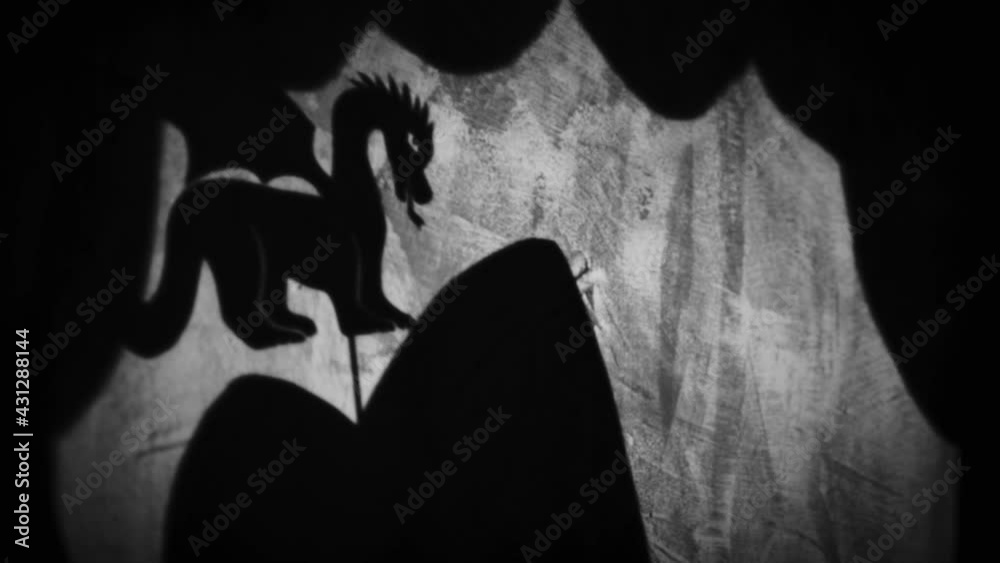 Vintage animation, shadow theatre on a wall. Pantomime, fantasy story ...