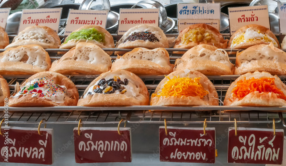 Stall of typical Thai sweets on display at a traditional market, Hua ...