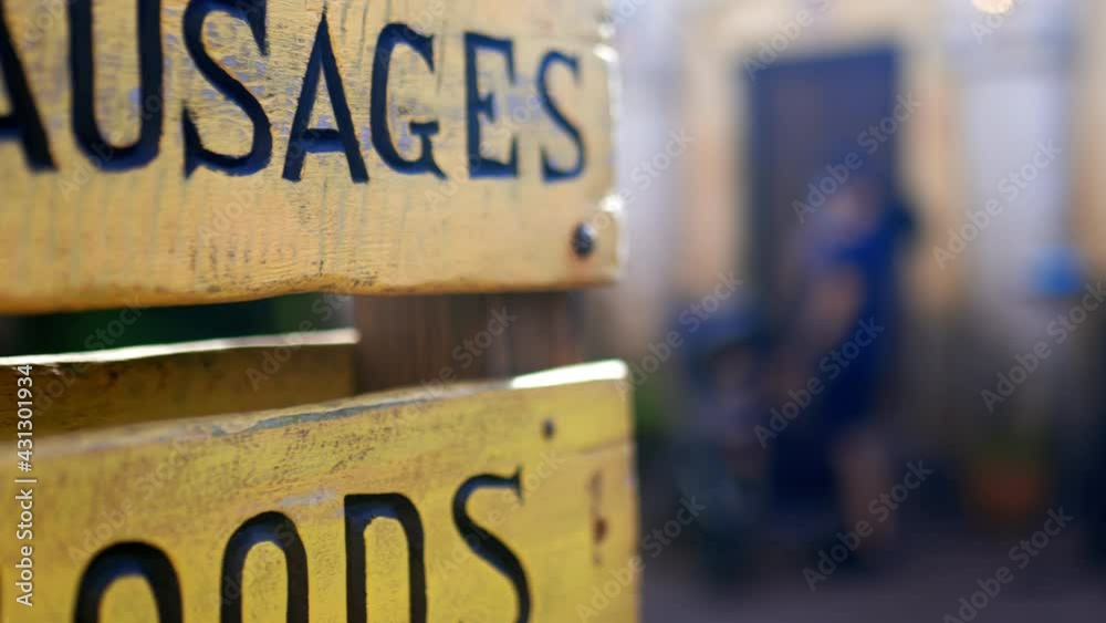 Yellow vintage-looking signs for food with blurry background Stock ...