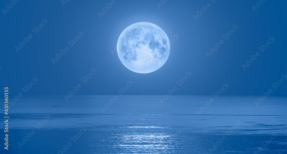 Full moon rising over empty ocean at night "Elements of this image ...