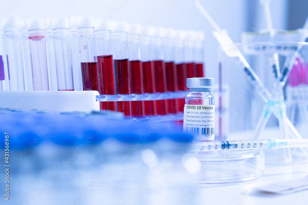 Glass bottle vial and syringe with Covid-19 Coronavirus vaccine in a ...