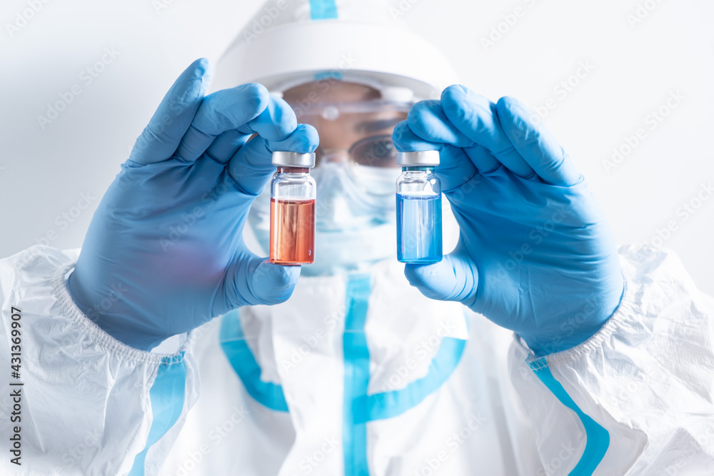Medical Nurse in safety gloves and protective mask is showing different ...