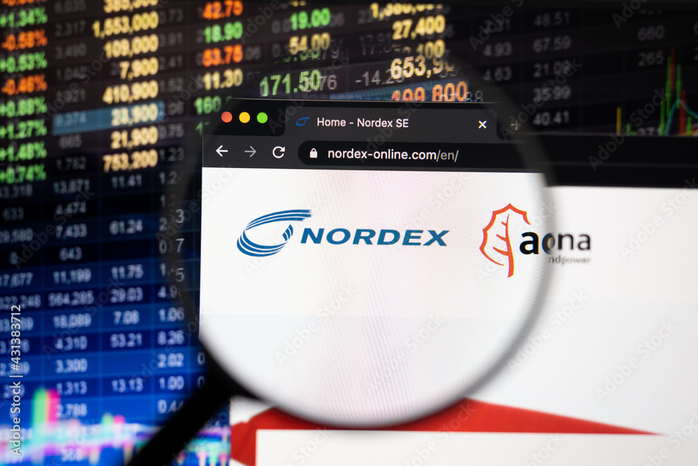 Nordex company logo on a website with blurry stock market developments ...