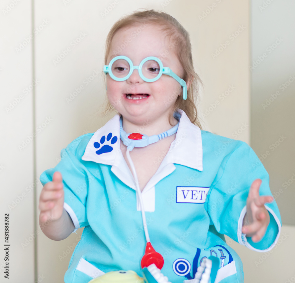Down syndrome in a little girl dressed as a doctor, a disabled child ...