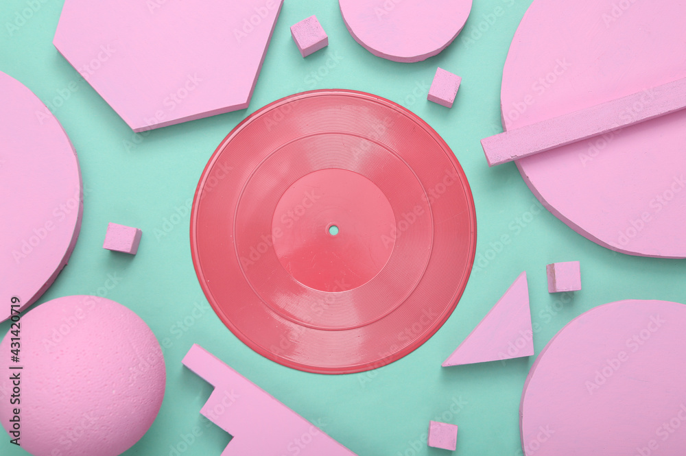 Creative music layout. Pink vinyl record with different geometric ...