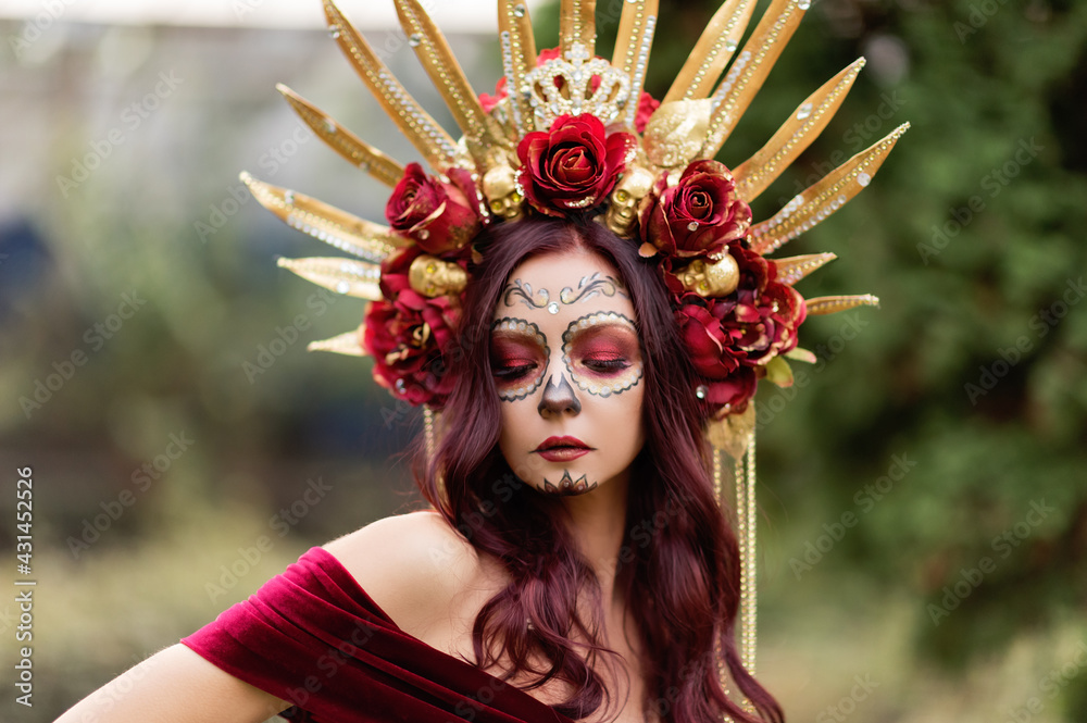 Young woman with painted skull on her face for Mexico's Day of the Dead ...