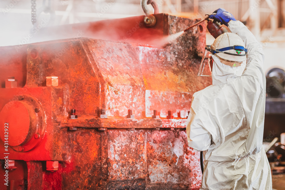 Airless Spray Painting, Worker painting on heavy gear machine steel ...