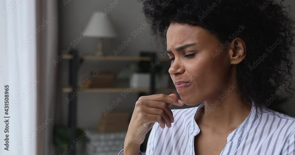 Close up face of stressed young African woman feels angry frustrated ...
