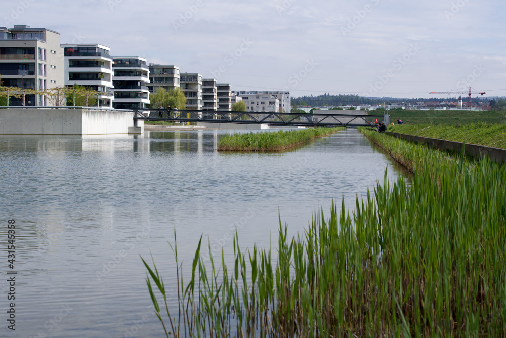 Park named Glattpark with apartment buildings, pond and metal ...