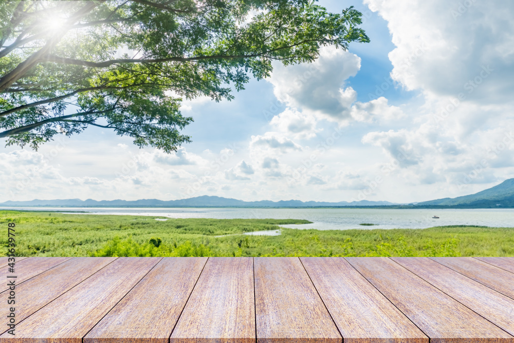 Empty wooden table with nature landscape (lagoon, mountain, sky ...