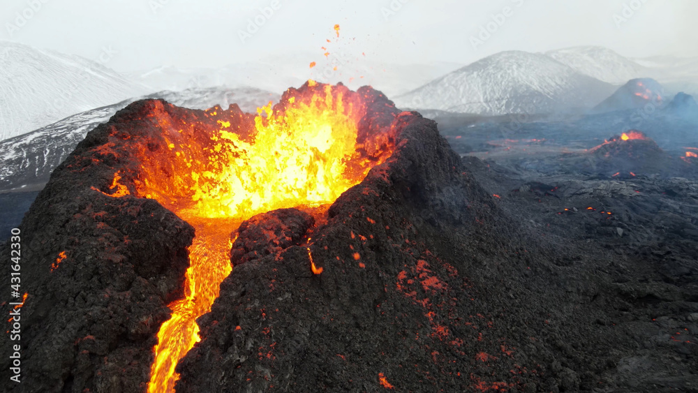 lava eruption volcano with snowy mountains, Aerial view Hot lava and ...