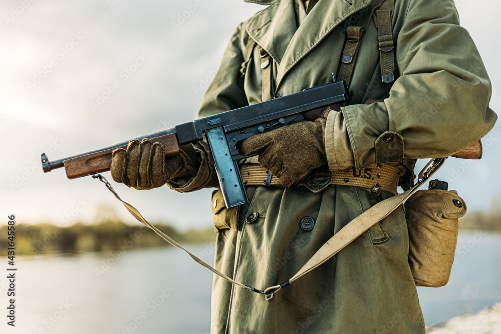 Soldier Of USA Infantry Of World War II Holds Submachine Weapon In ...
