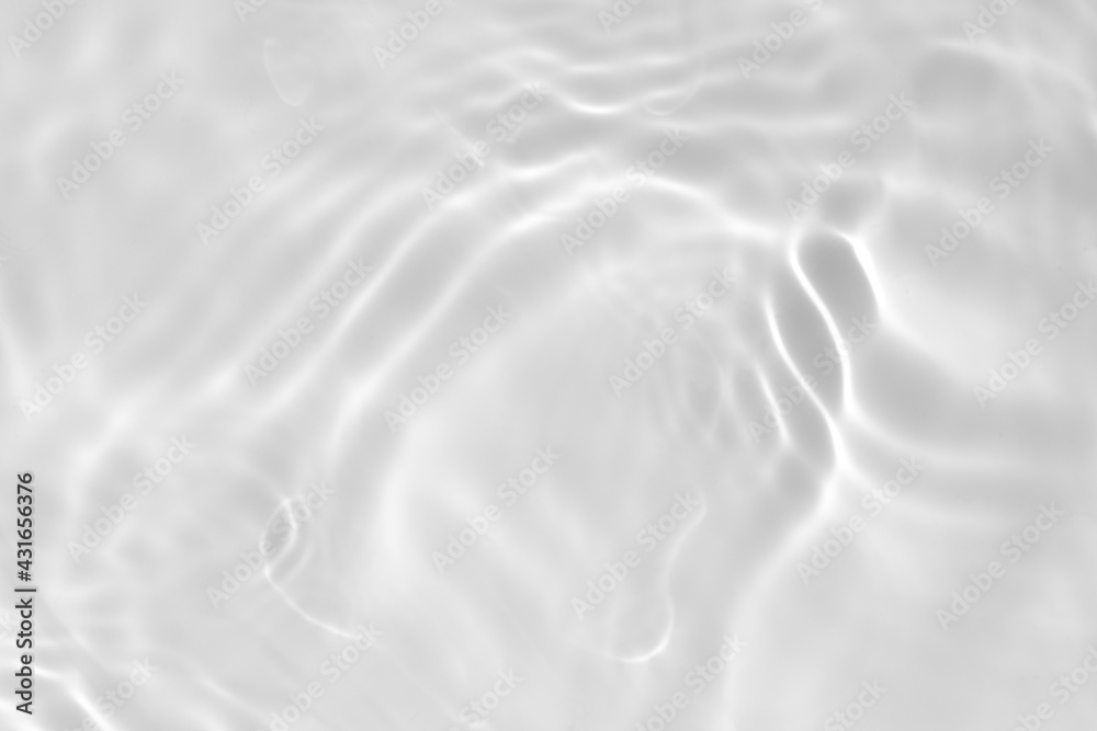 Closeup of desaturated transparent clear calm water surface texture ...