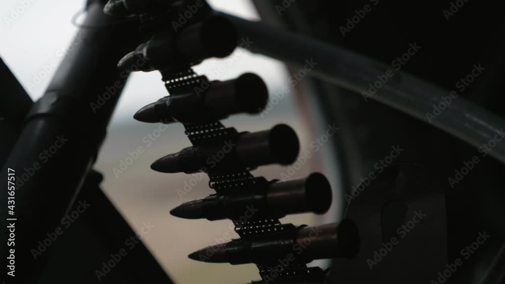 Video Stock Contemporary machine gun with a cartridge tape and bullets ...