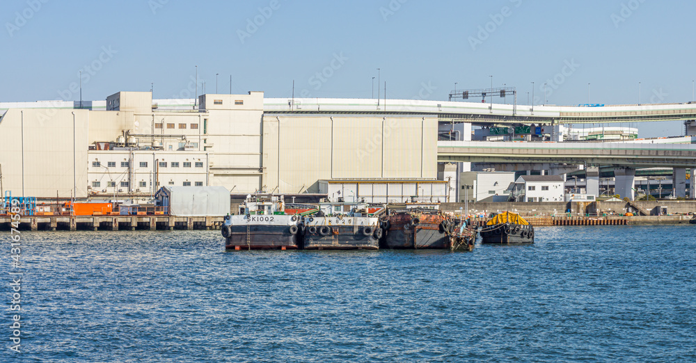 Cargo barges at sea port. This area is located at Osaka bay in Japan ...