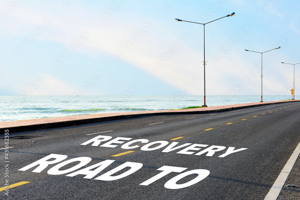Road to recovery written on seaside town road . Challenge with success ...