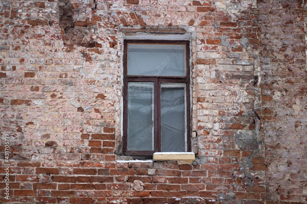 A window in a brick wall. Destroyed wall in an old building ...
