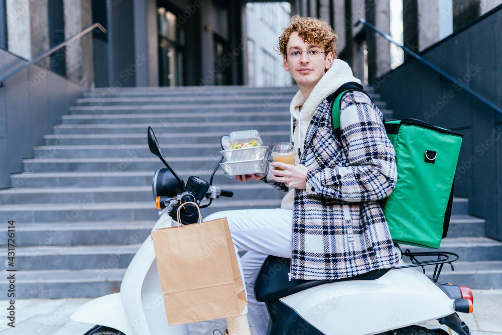 Food delivery service concept. Portrait of man rider on motorbike ...