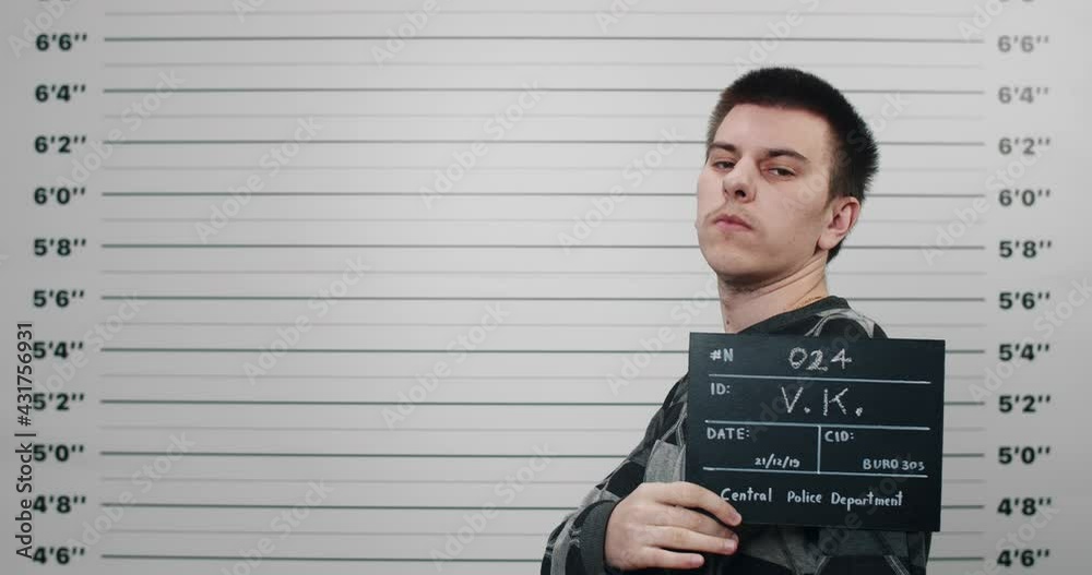 Side profile mugshot of male person turning head and looking to camera ...