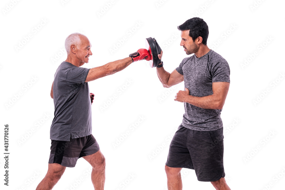 Elderly male athlete in excellent physical shape, in boxing gloves ...