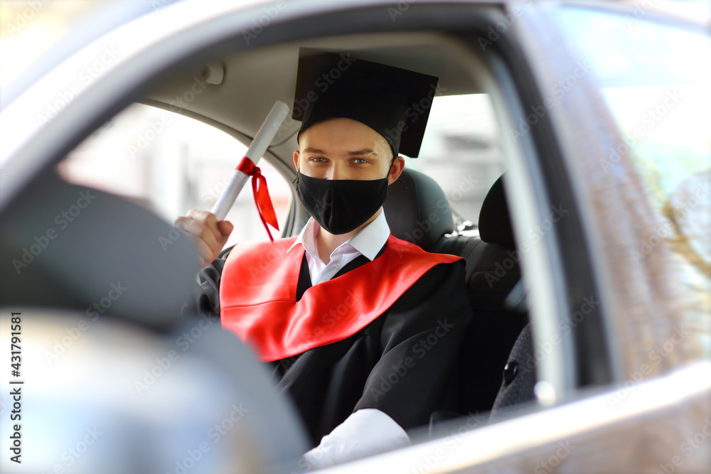 the graduate student in graduation gown and a square cap and a face ...