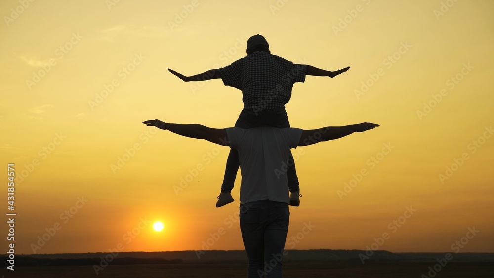 Carefree dad and little child play together, fantasize on plane with ...