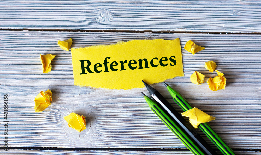 REFERENCES - word on a yellow tattered piece of paper with pencils and ...