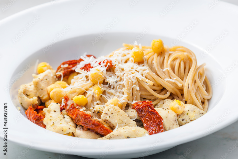 spaghetti with dry tomato and chicken peas Stock Photo | Adobe Stock