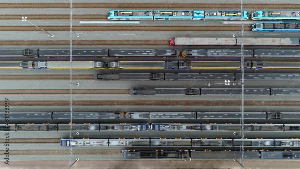 Aerial top down view of trains parked at a service station that run ...
