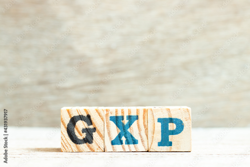 Alphabet letter block in word GXP on wood background Stock Photo ...