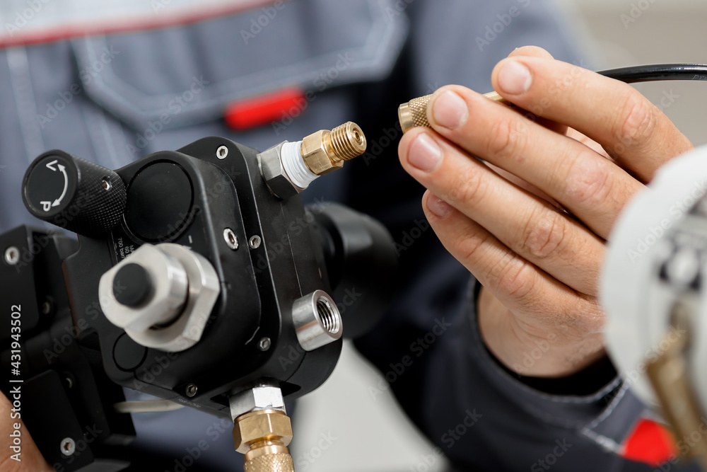 The metrology and standardization laboratory specialist connects the ...