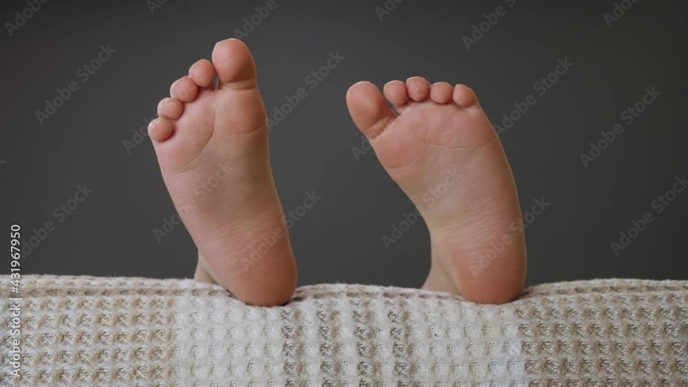 Little girl sleeping in bed. Child feet in bed comfortable. Cute child ...