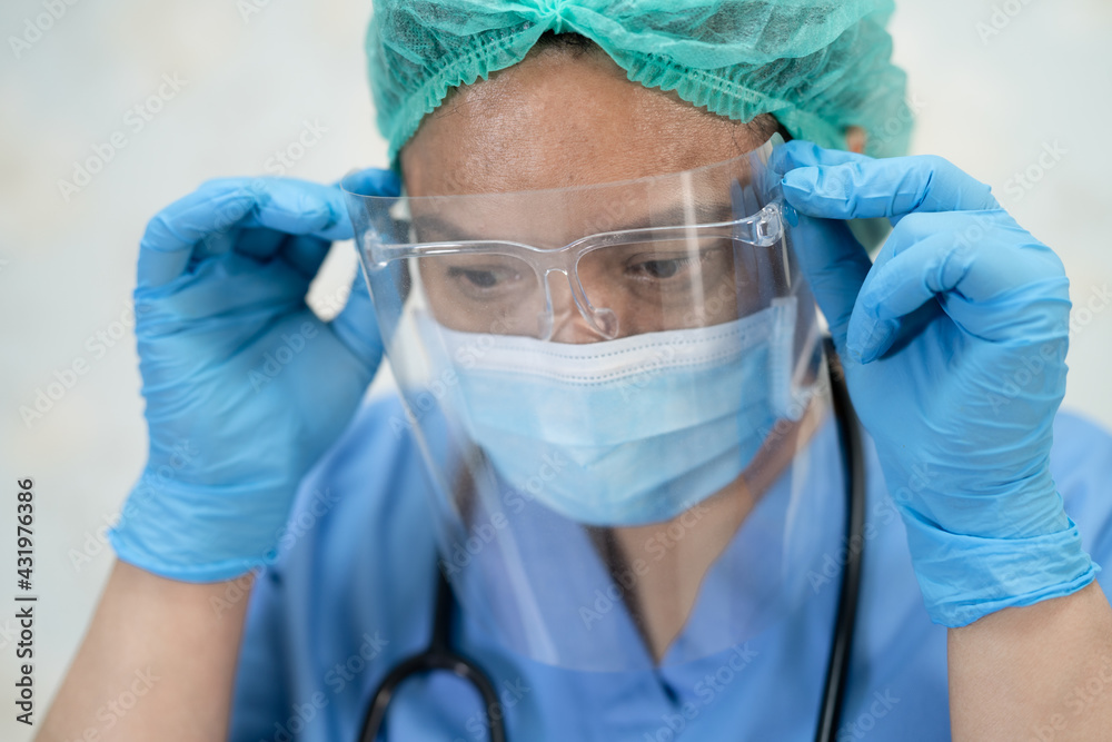 Asian doctor wearing face shield and PPE suit new normal to check ...