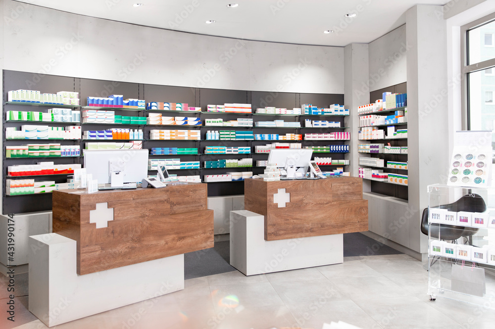 Checkout counters against shelves with medicines at pharmacy Stock ...